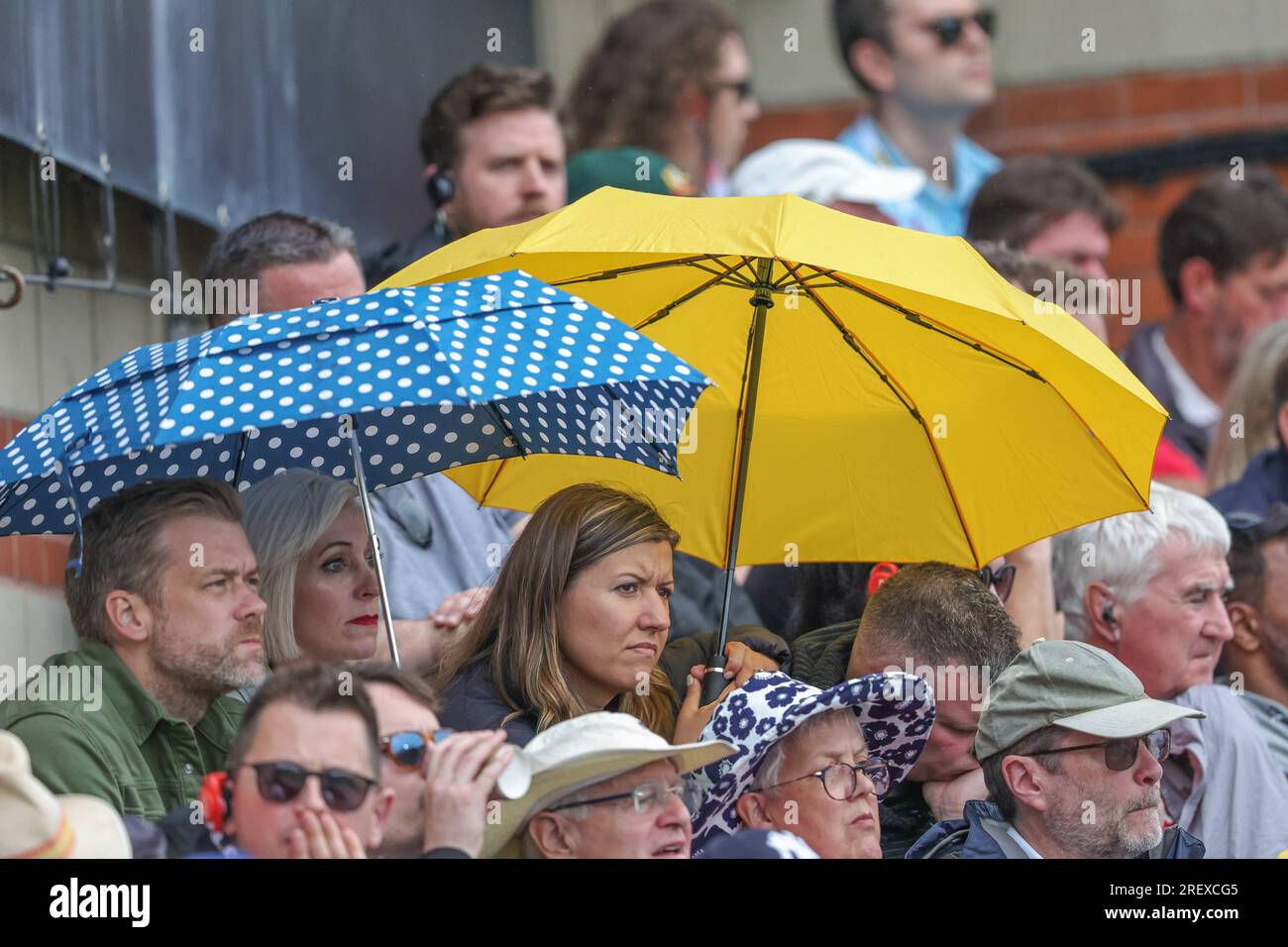 Fans put brolly’s up as it starts to rain during the LV= Insurance ...
