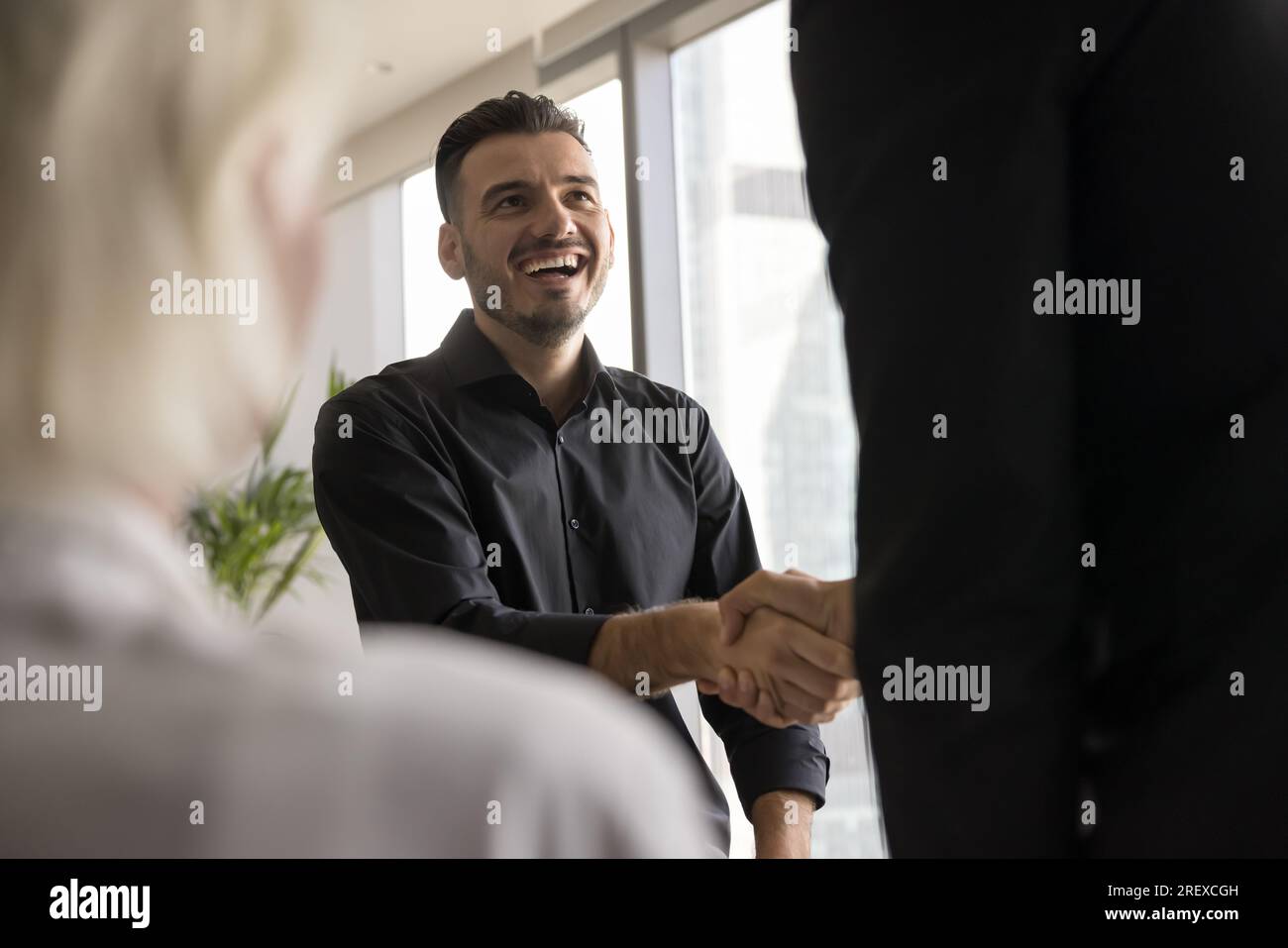 Happy candidate man getting job, shaking hands Stock Photo - Alamy