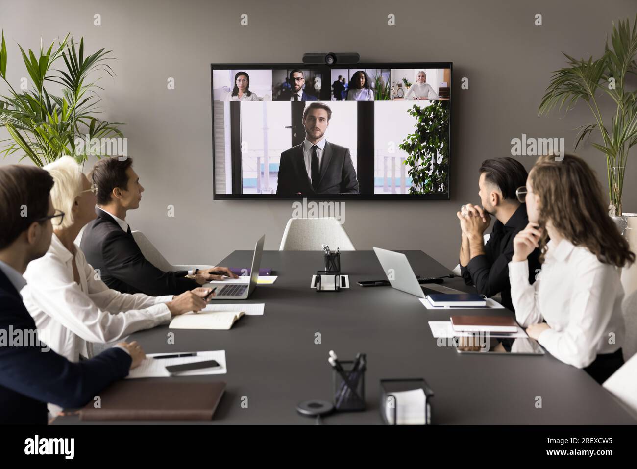 Business team and leader meeting online and offline Stock Photo - Alamy