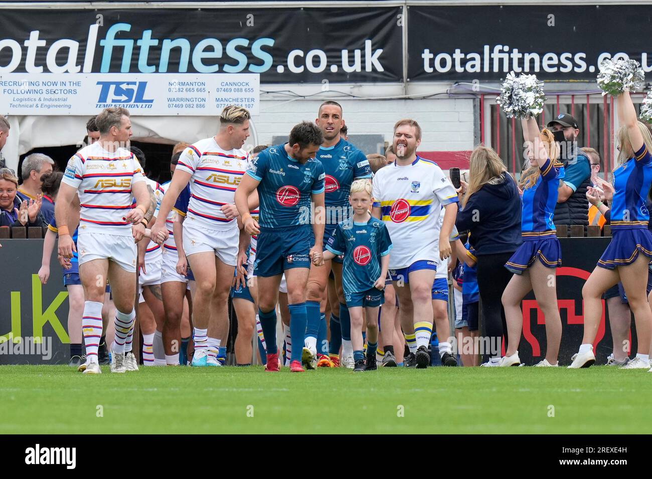 Stefan Ratchford #4 of Warrington Wolves leads out his team during the ...