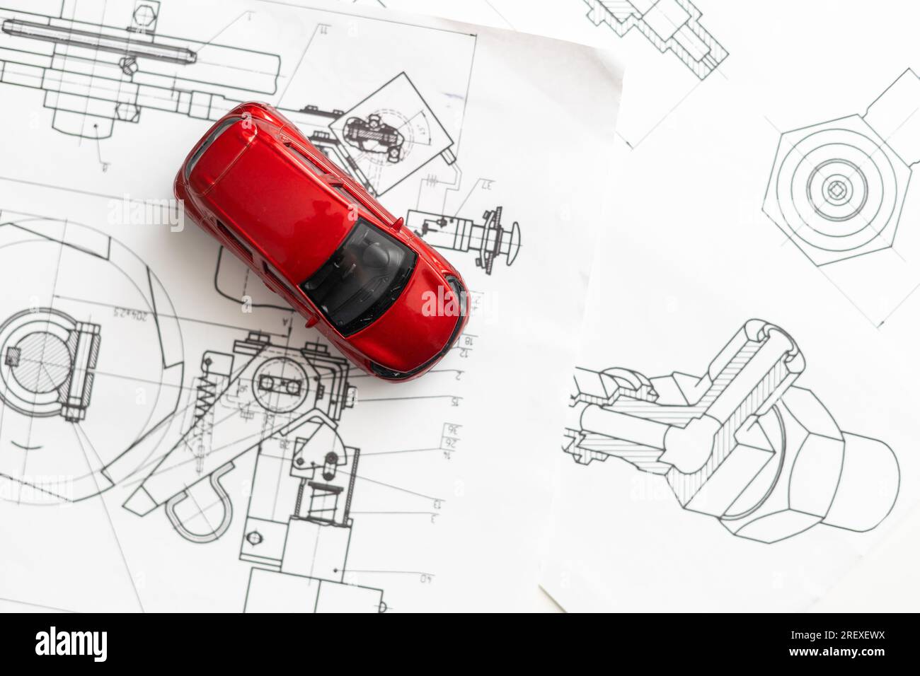 small car model and blueprint sheets Stock Photo - Alamy
