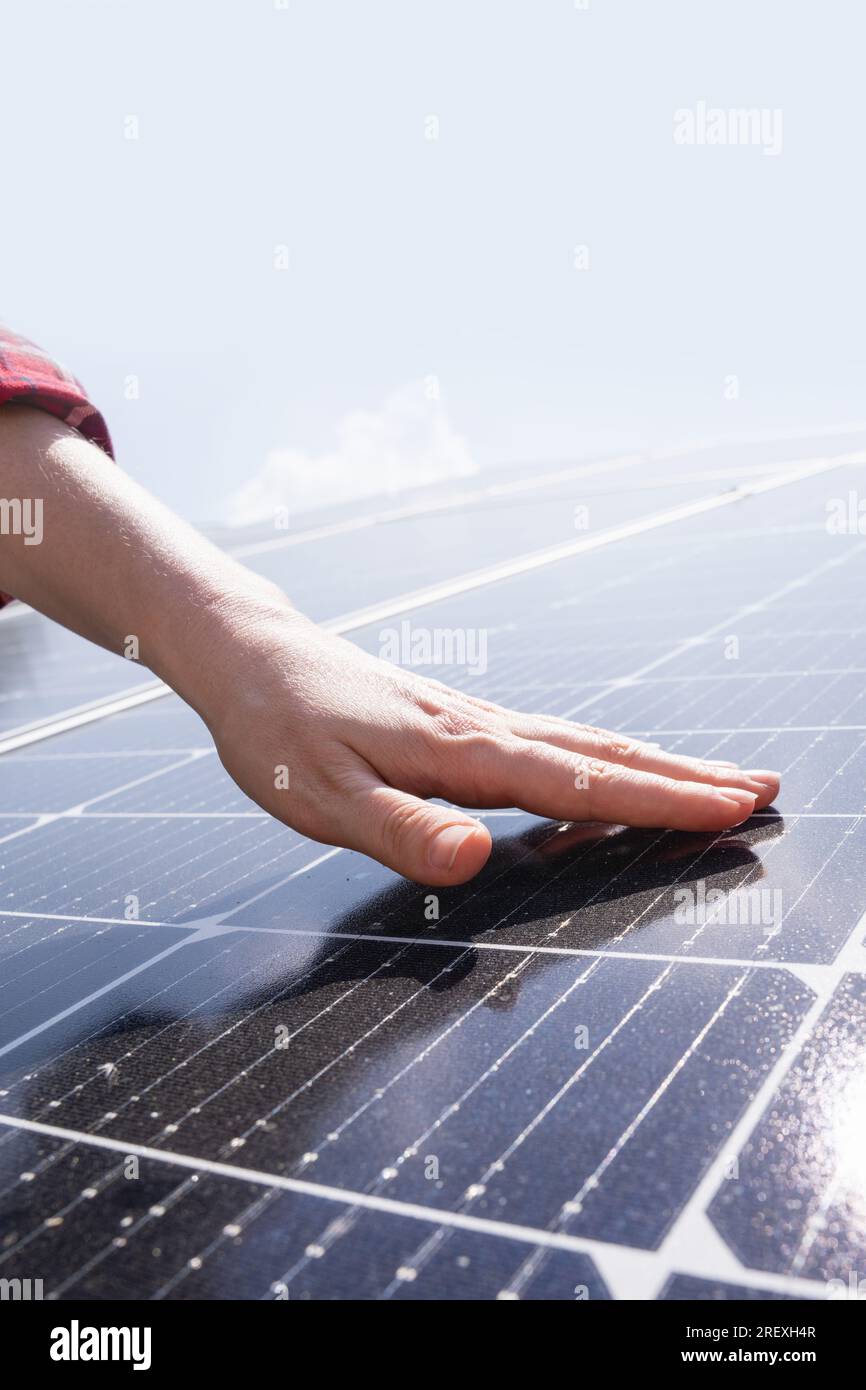 Close-up of a hand touching a solar panel Stock Photo - Alamy