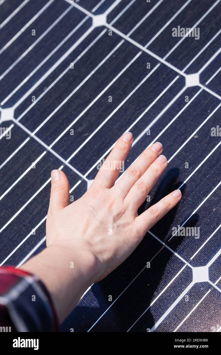 Close-up of a hand touching a solar panel Stock Photo - Alamy