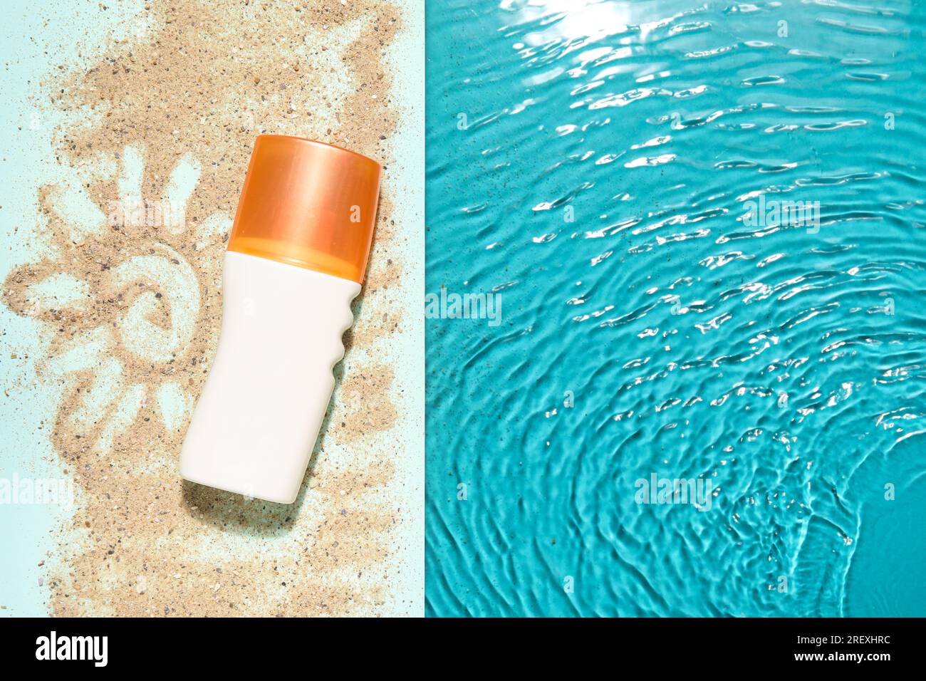 Sunscreen cream on edge of swimming pool Stock Photo - Alamy