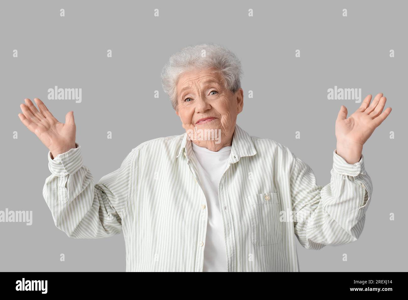 Woman shrugging hands in hi-res stock photography and images - Alamy