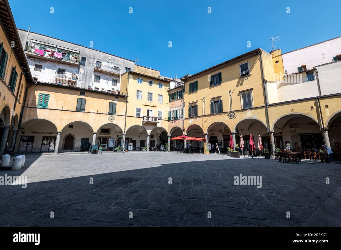 Under the main arch leading into a small medieval square, Piazza delle ...