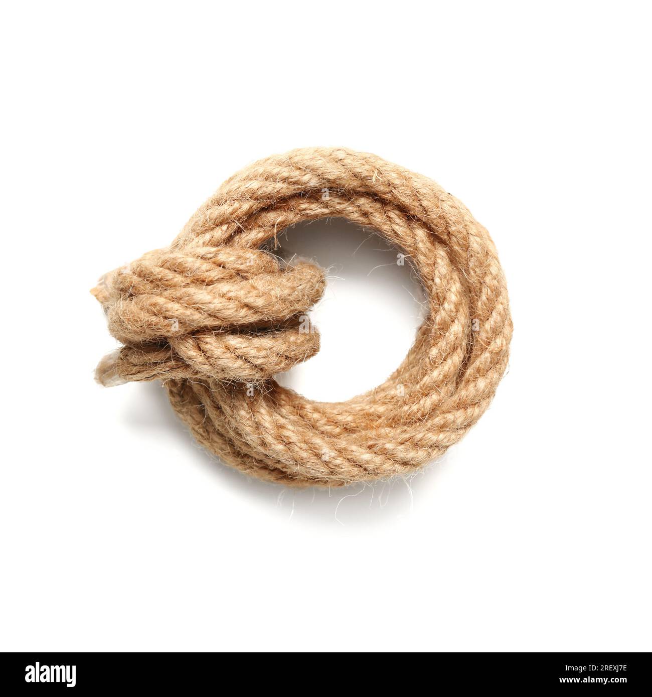 Rolled rope on white background Stock Photo - Alamy