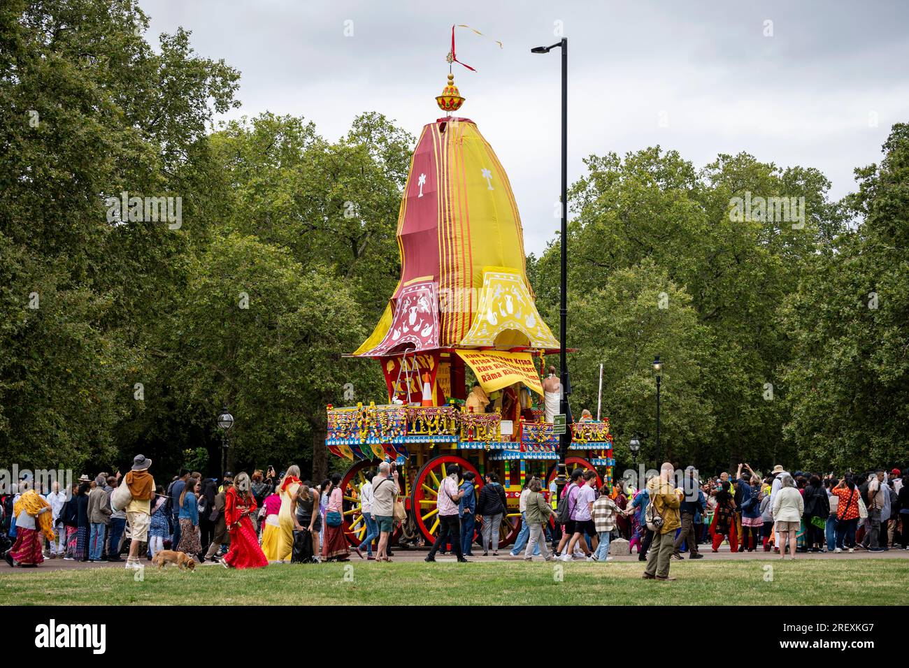 London, UK. 30 July 2023. Hare Krishna devotees pull the chariot at Hyde Park Corner during the ...