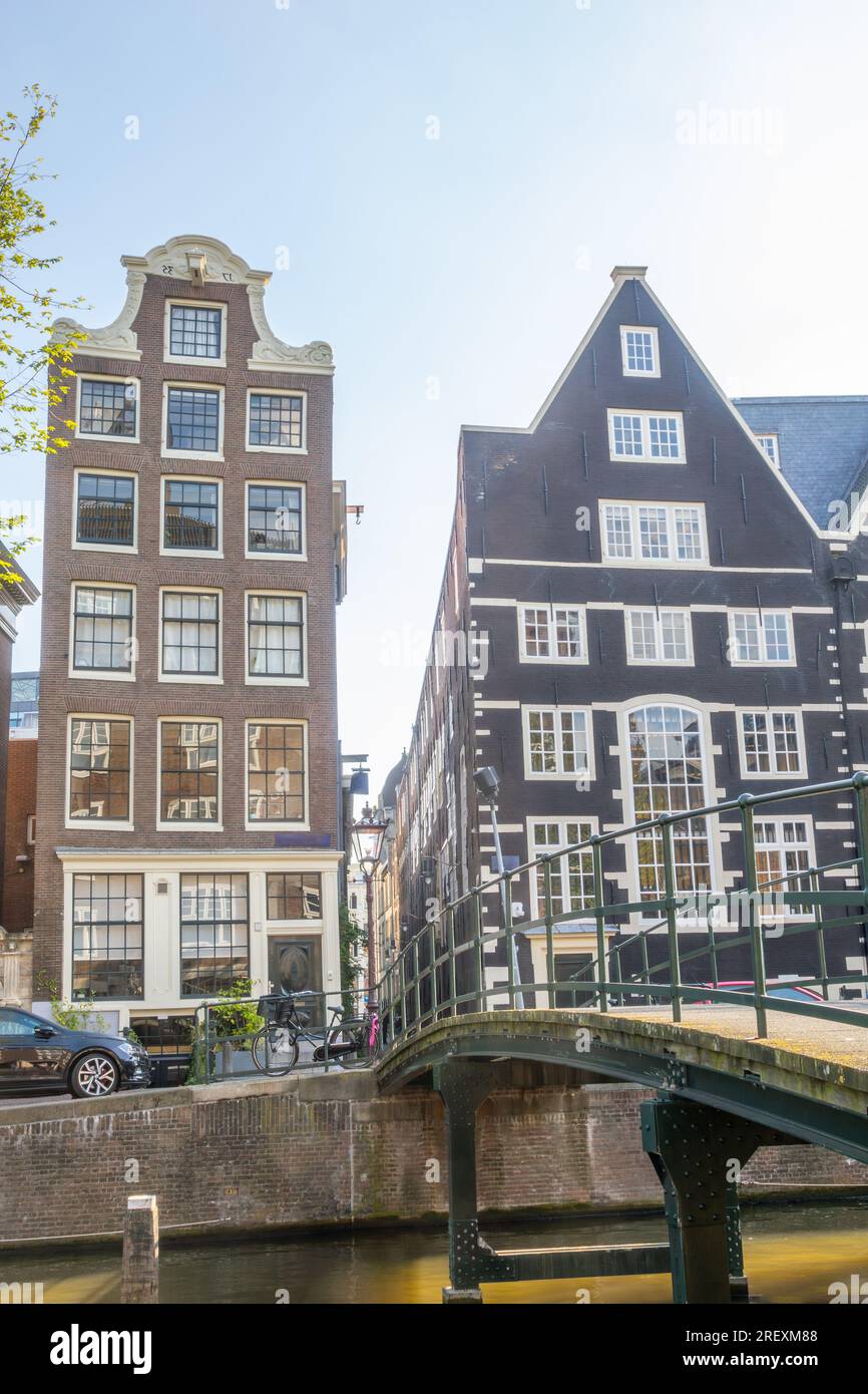 Netherlands. Sunny summer day in Amsterdam. Old footbridge over the ...