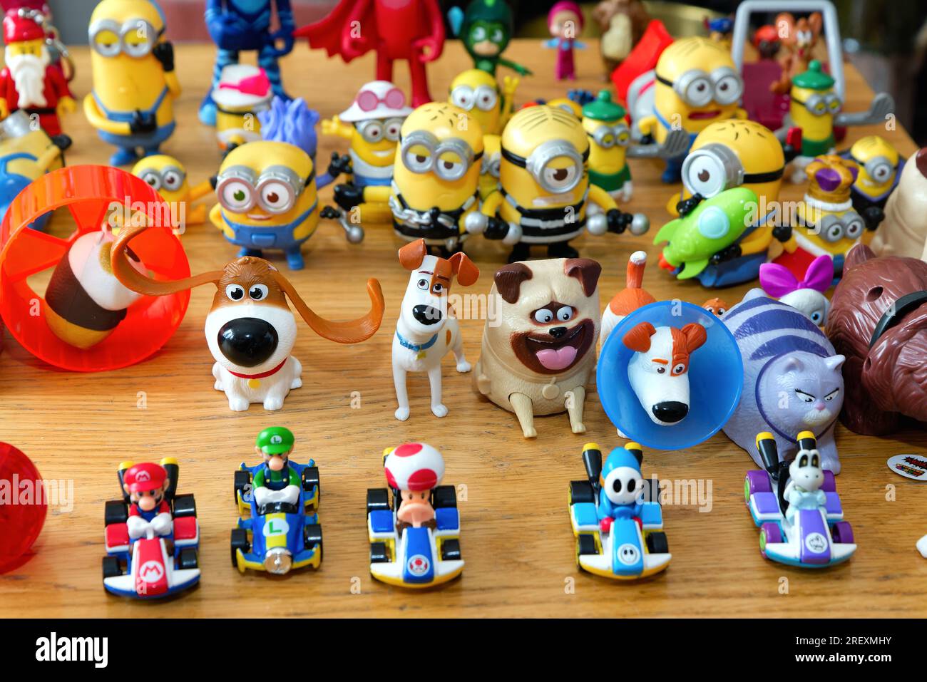 Close up of popular toy figures arranged in rows on a table top Stock ...