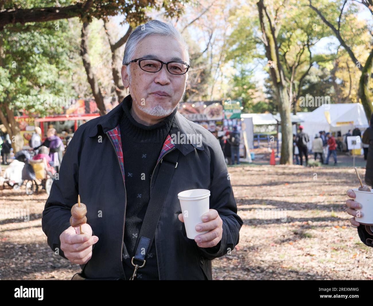 An older Japanese man eating dango and drinking coffee Stock Photo - Alamy