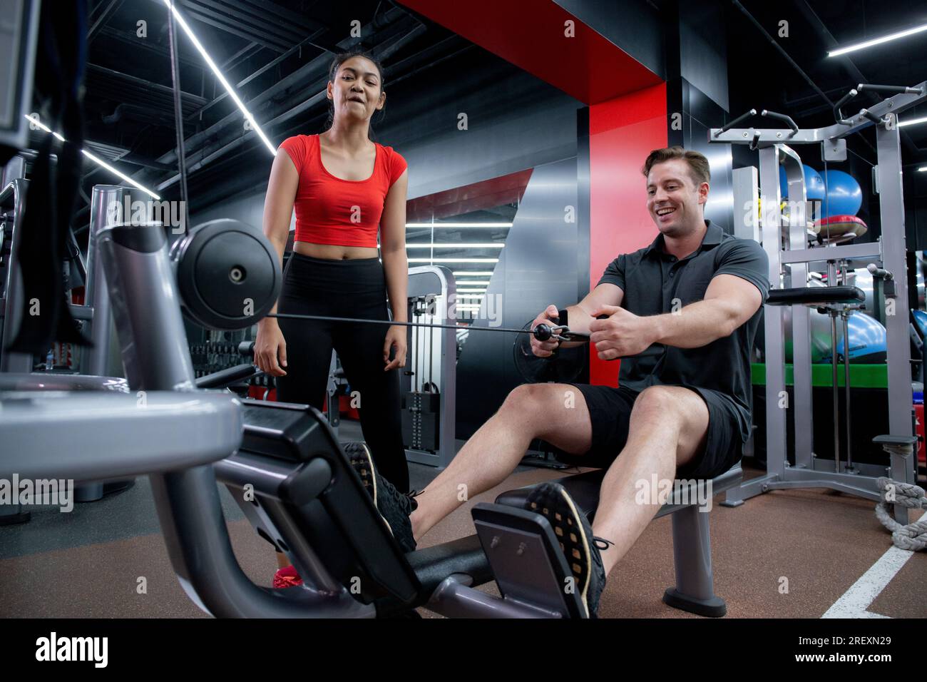 Coach woman guiding workout with hands muscles stretch with equipment ...