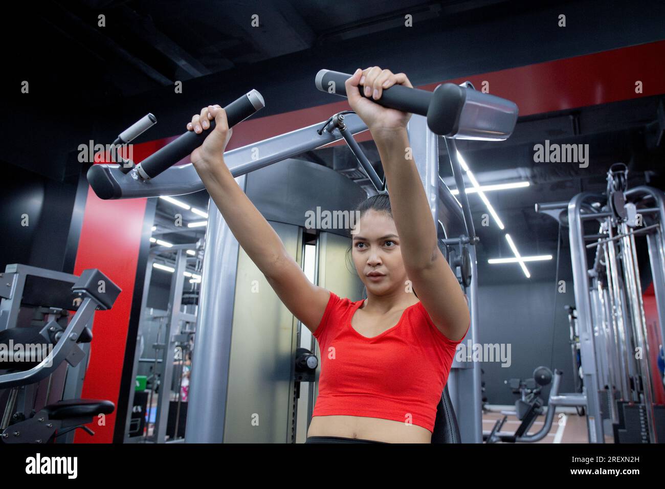 Young asian woman workout with strength training and determination with ...