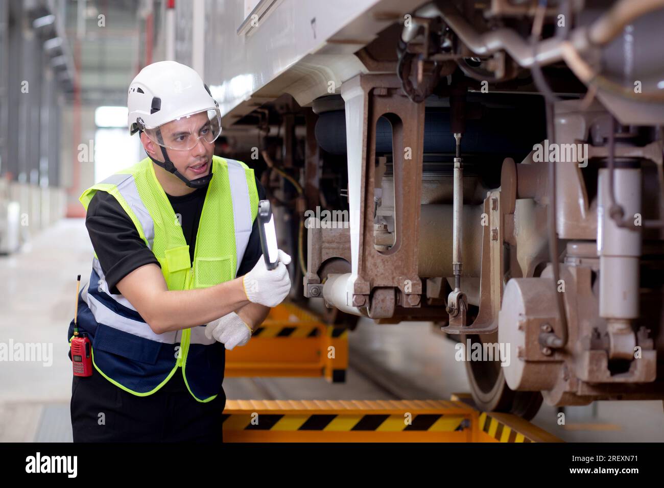 Young caucasian engineer man or worker looking and checking electric ...