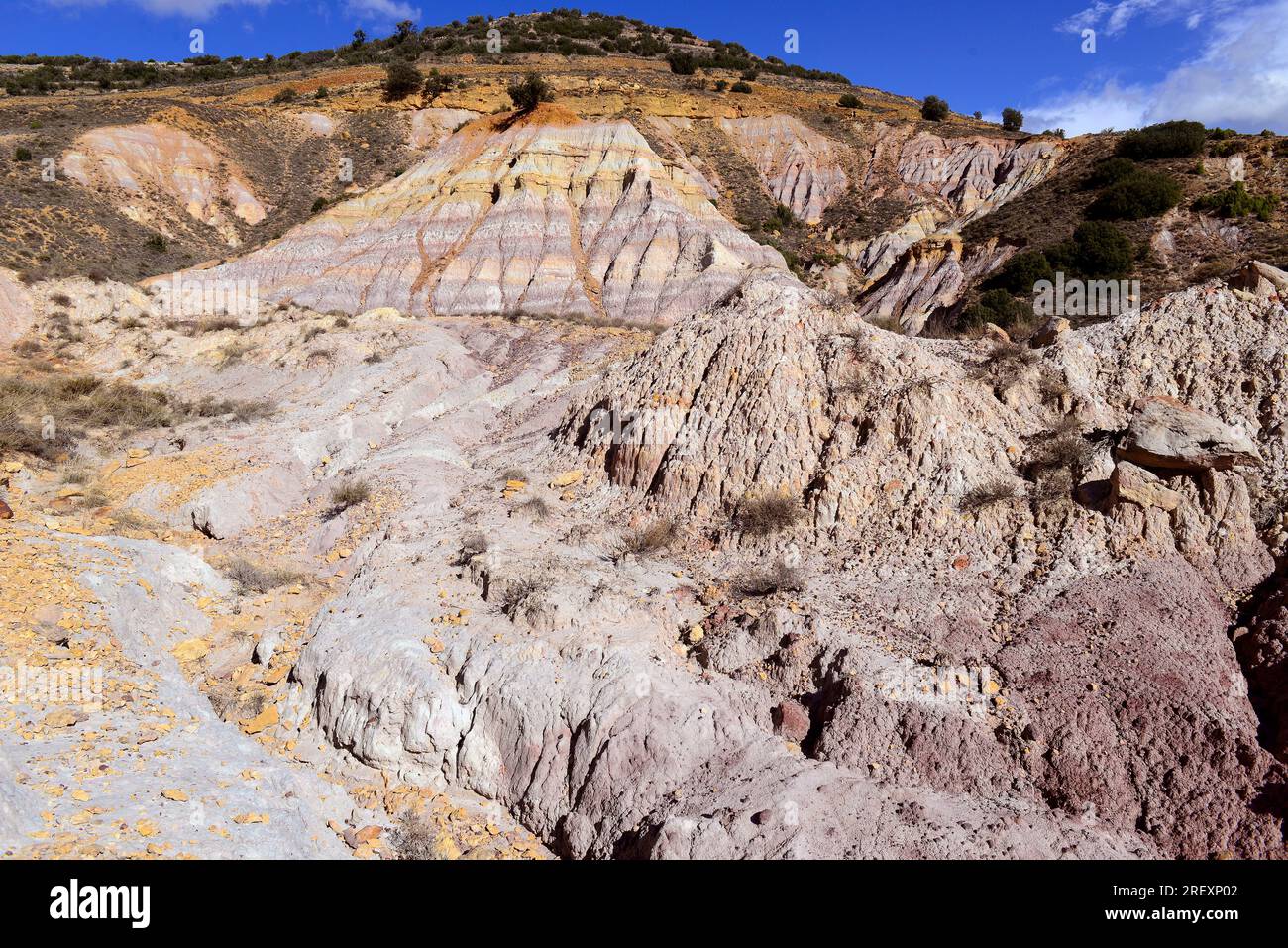 Badlands are a dry terrains formed with softer sedimentary rocks (clay ...