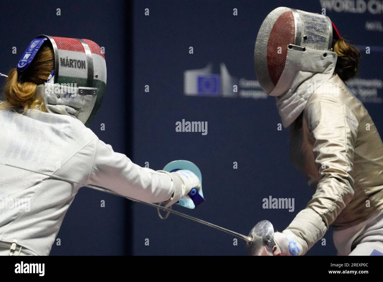 France's Sara Balzer, right, competes against Hungary's Anna Marton ...