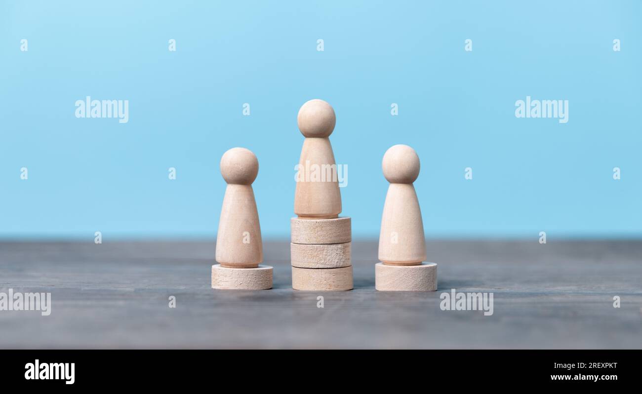 Wooden figure standing on the box for show influence and empowerment ...