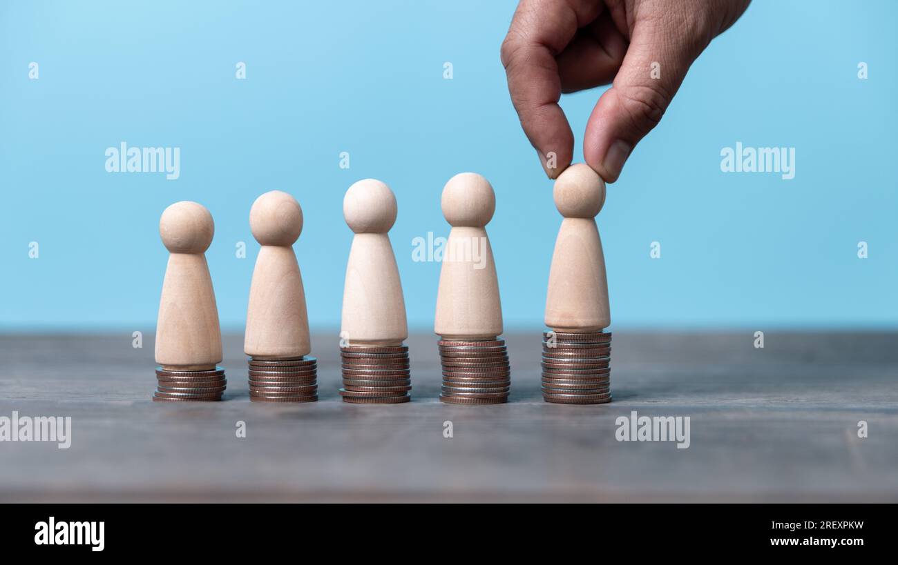 Building a strong team, Wooden blocks with people icon on blue ...