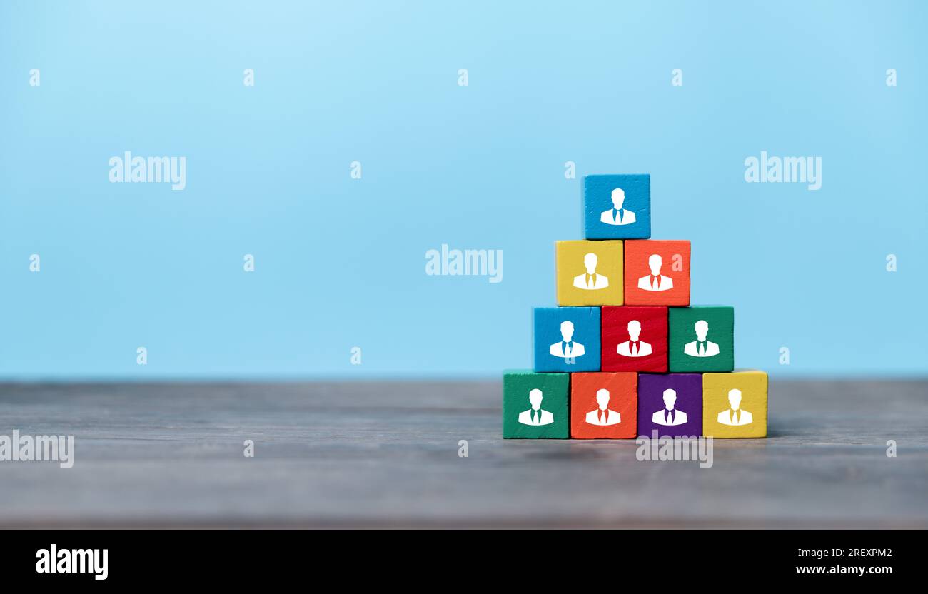 Building a strong team, Wooden blocks with people icon on blue ...