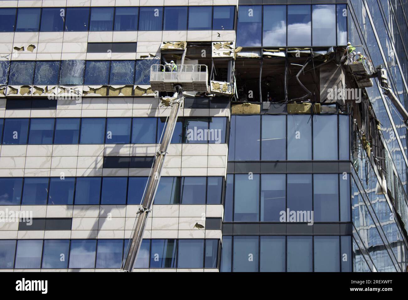 Moscow, Russia. 30th July, 2023. City workers use cranes to clean up ...