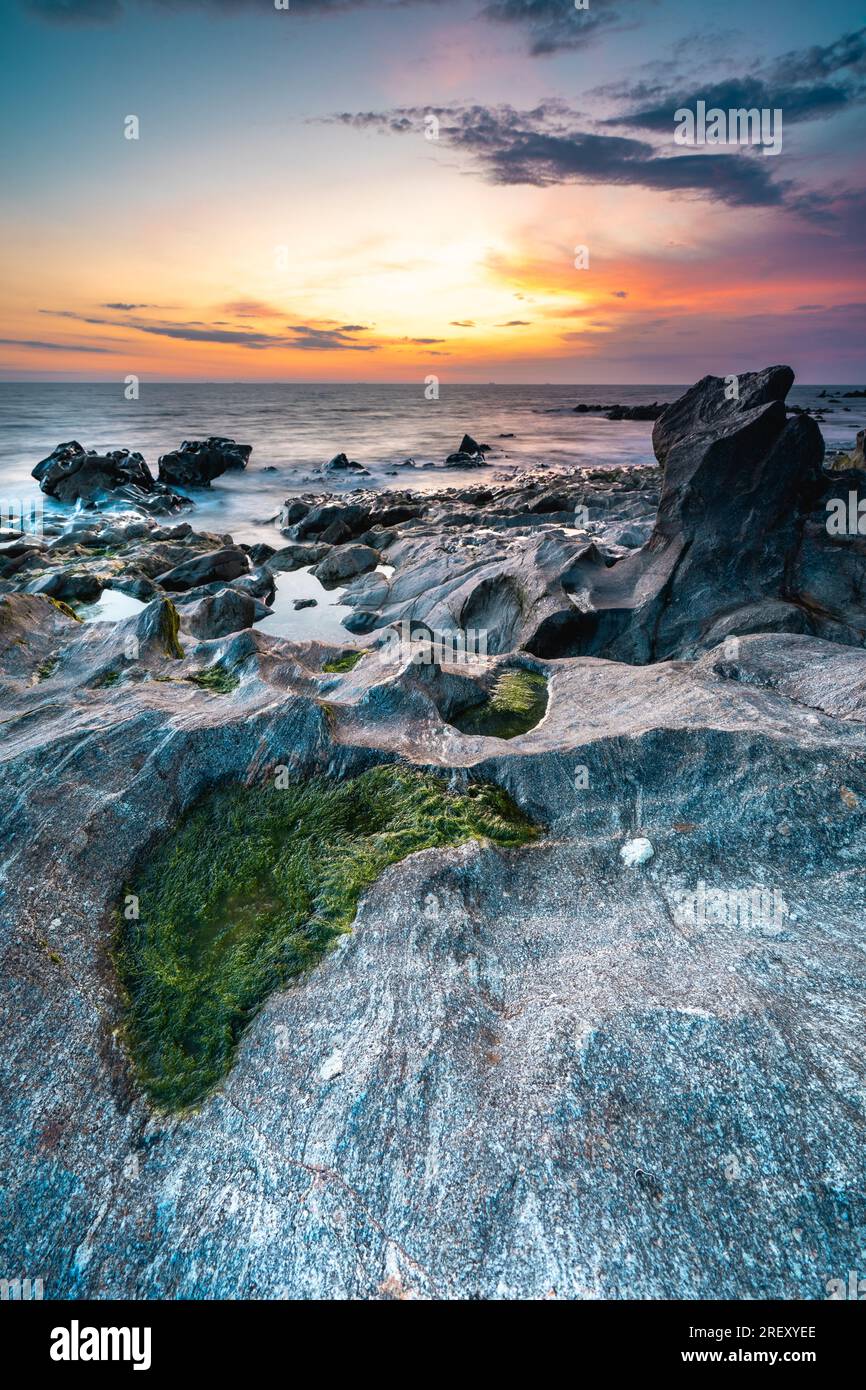 Sunset at the rocky beach at Vila Nova de Gaia, Portugal Stock Photo ...