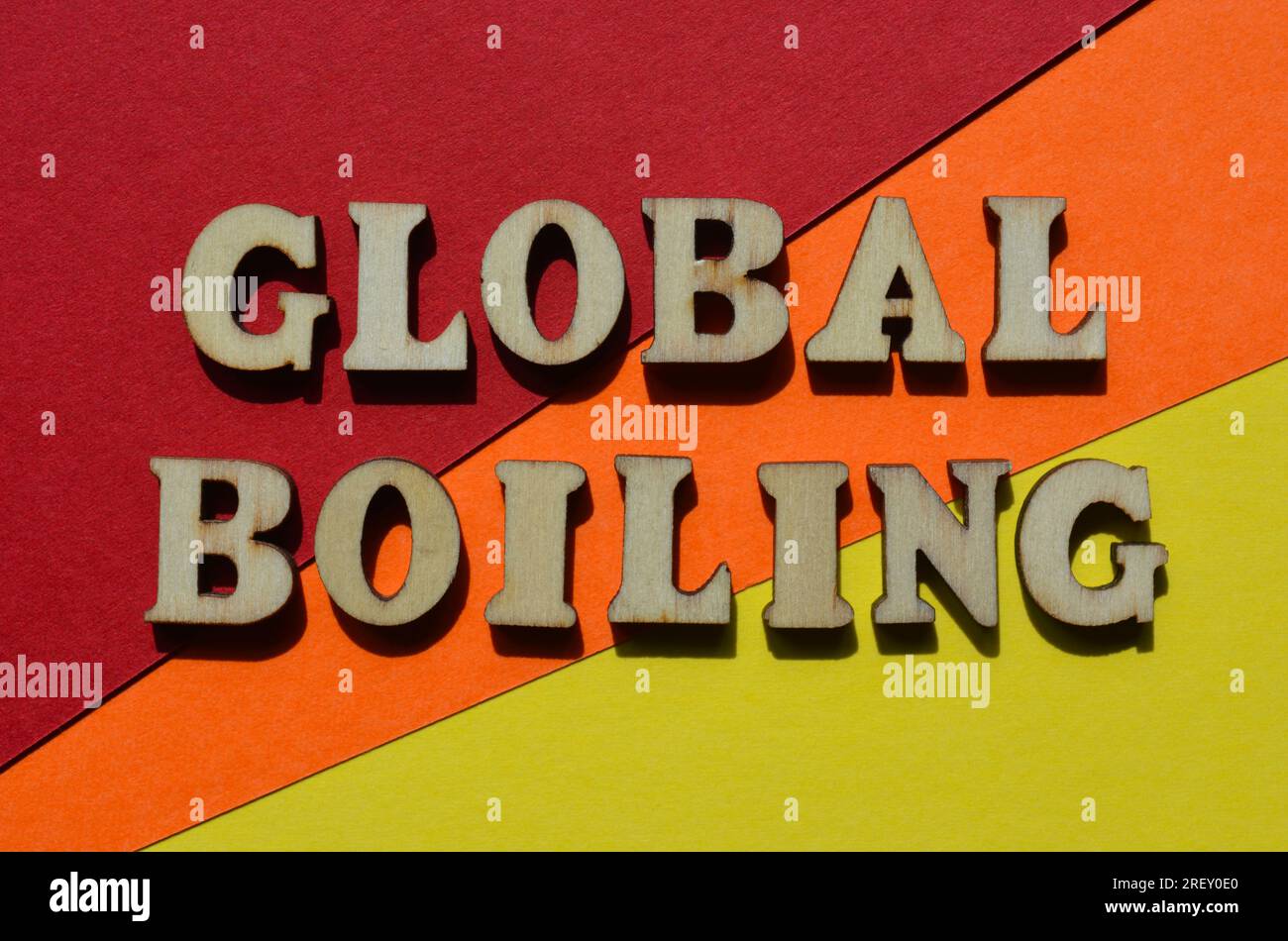 Global Boiling, words in wooden alphabet letters isolated on red ...