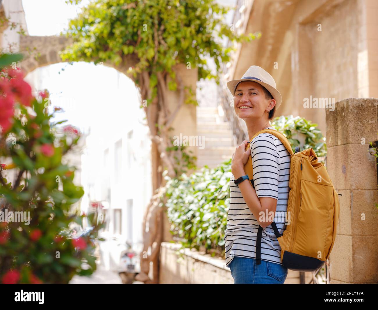 summer trip to Rhodes island Greece. Young Asian woman in striped ...
