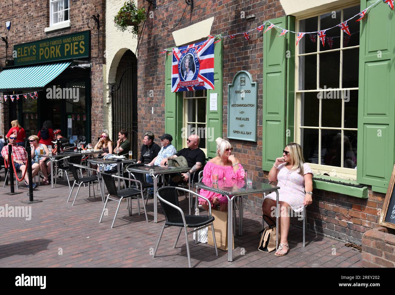 People drinking outside hotel pub during Queen's Platinum Jubilee in ...