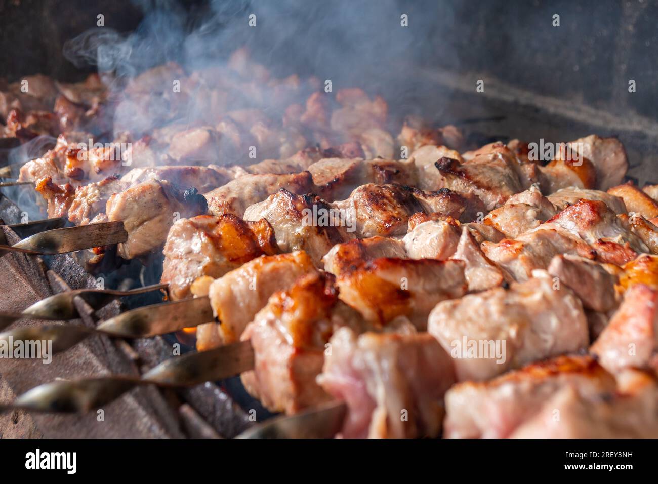 Traditional georgian mtsvadi, grill on the coals with smoke. Shashlik ...