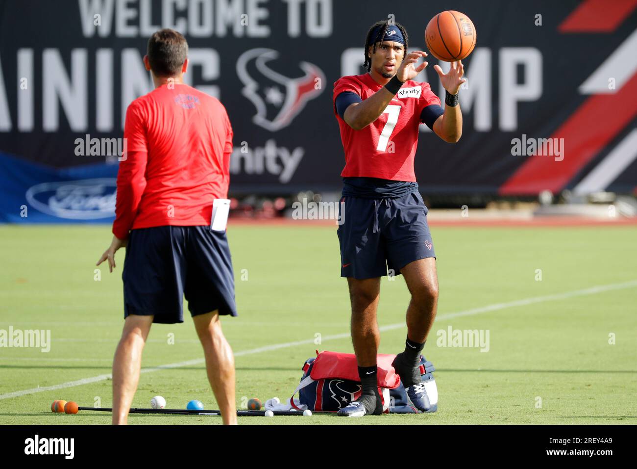 Houston Texans quarterback C.J. Stroud (7) warms up with a basketball ...