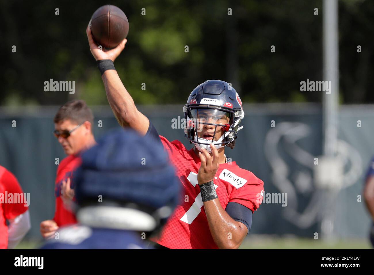 Houston Texans quarterback C.J. Stroud, right, throws passing drills ...
