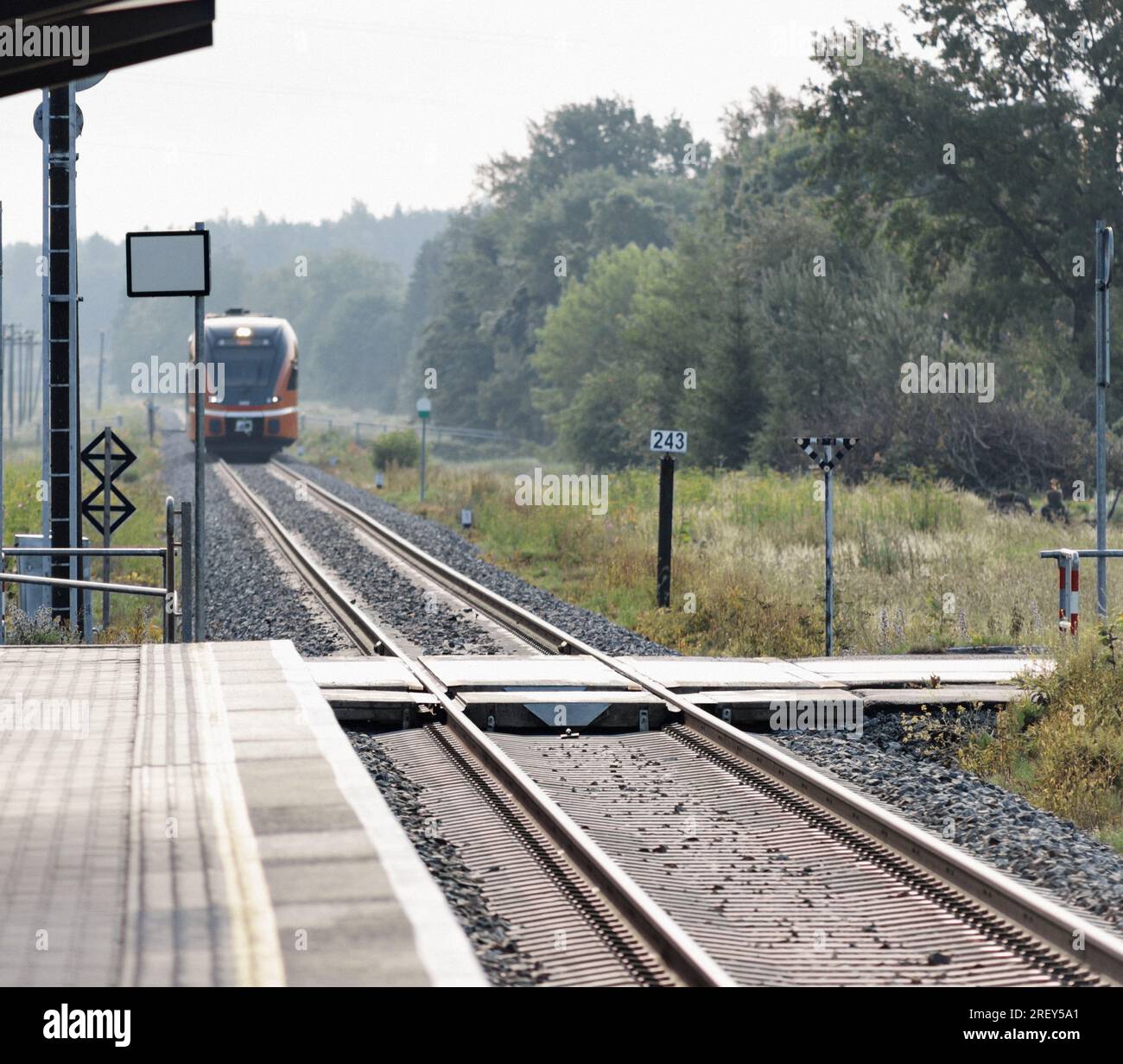 Railway at a small station in Estonia. Passenger transport. Railway ...
