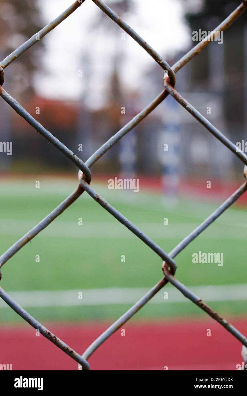 Seats in the stadium behind the fence close up Stock Photo - Alamy