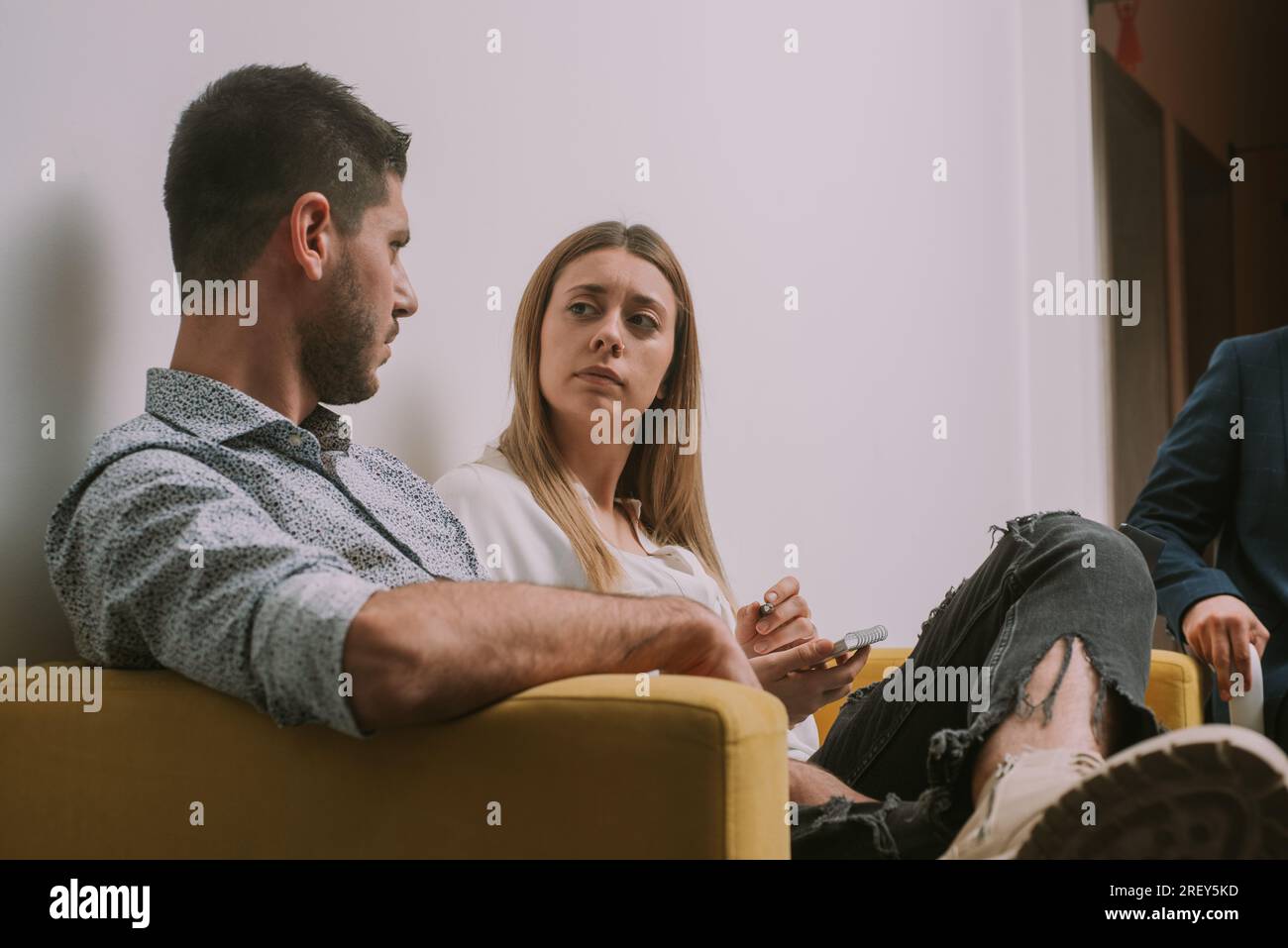 Misunderstanding between two young colleagues at work. They are having ...