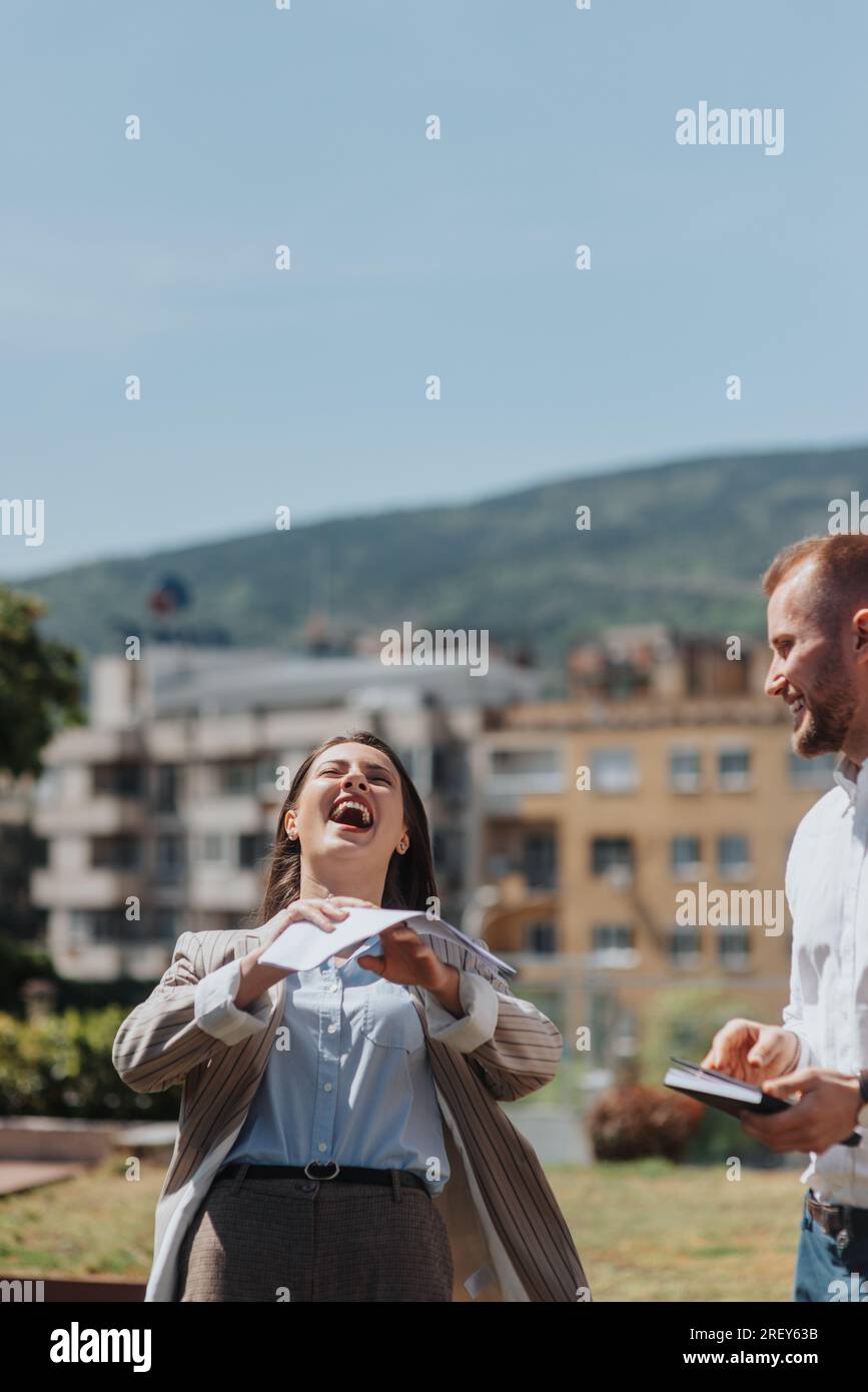 Gorgeous businesswoman laughing at her male colleague joke. Young ...