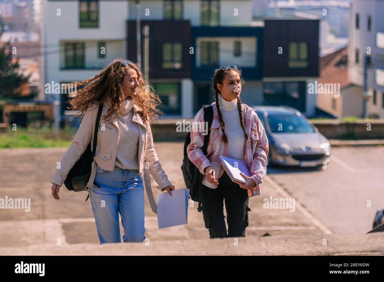 High school girls walking upstairs. Going to school concept Stock Photo ...