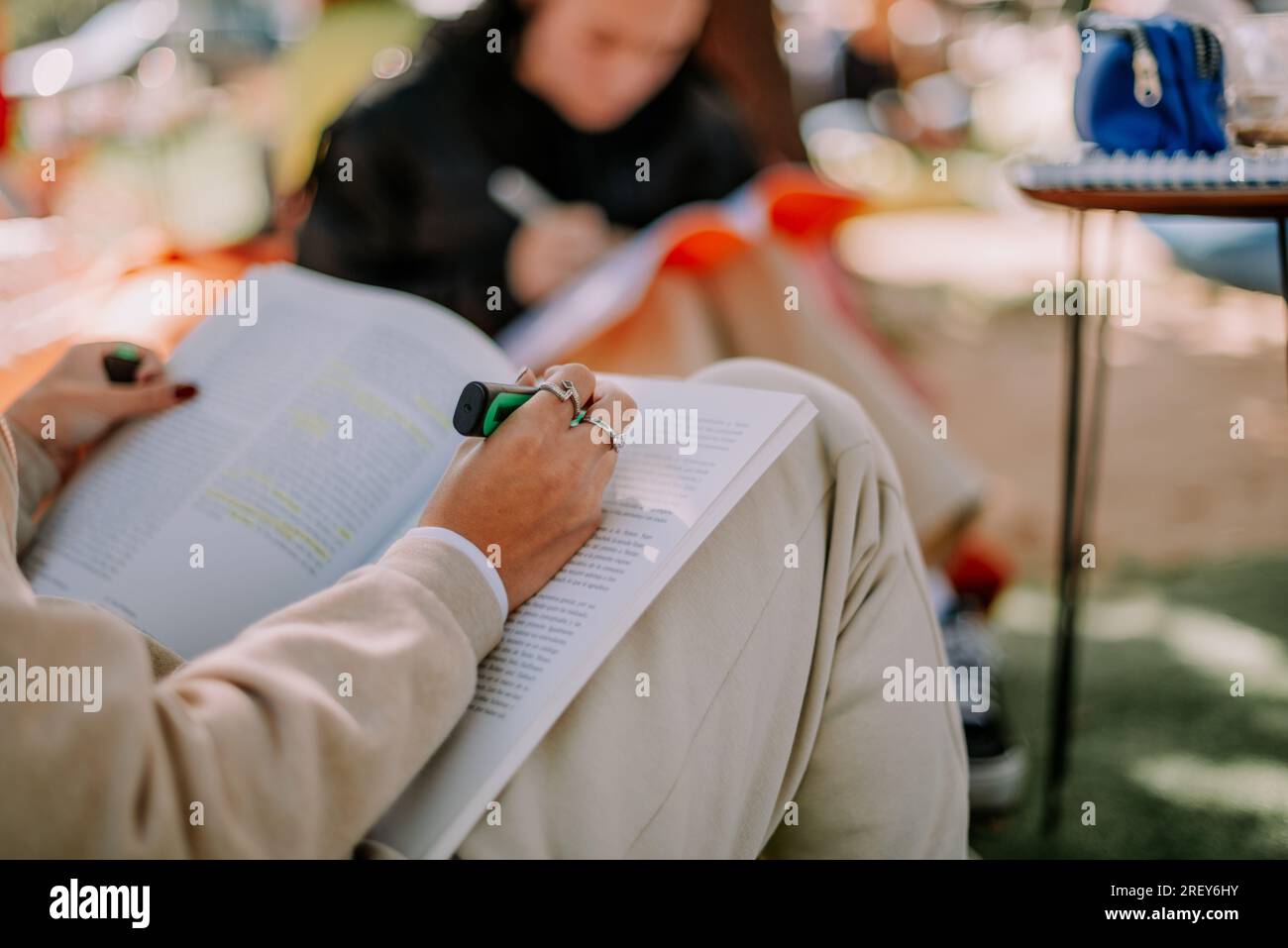 Female student underlining important parts Stock Photo - Alamy