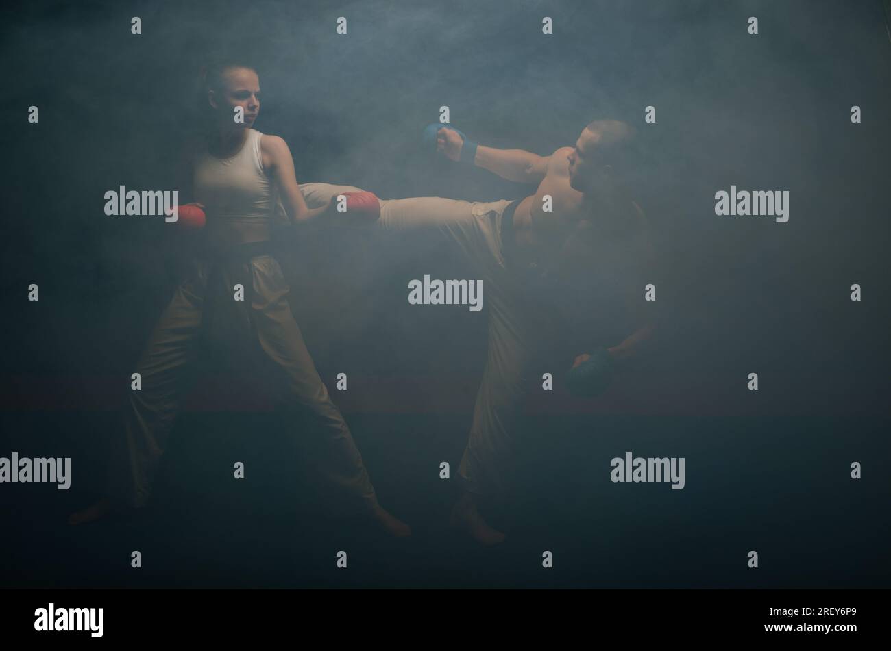 Young and strong karate friends doing the Ura Mawashi Geri fight in the ...