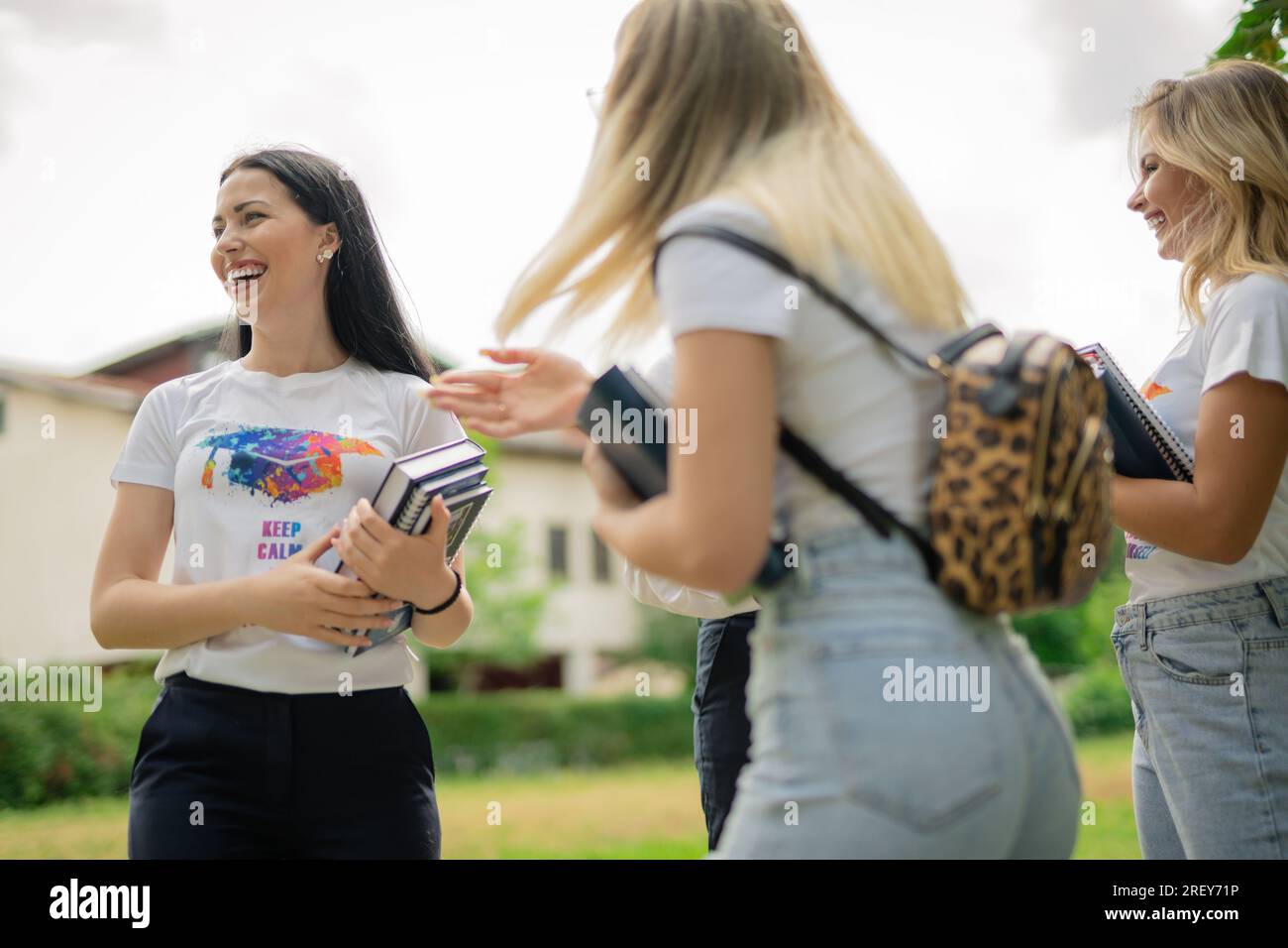 Group of teenage high school students standing outside , talking and ...