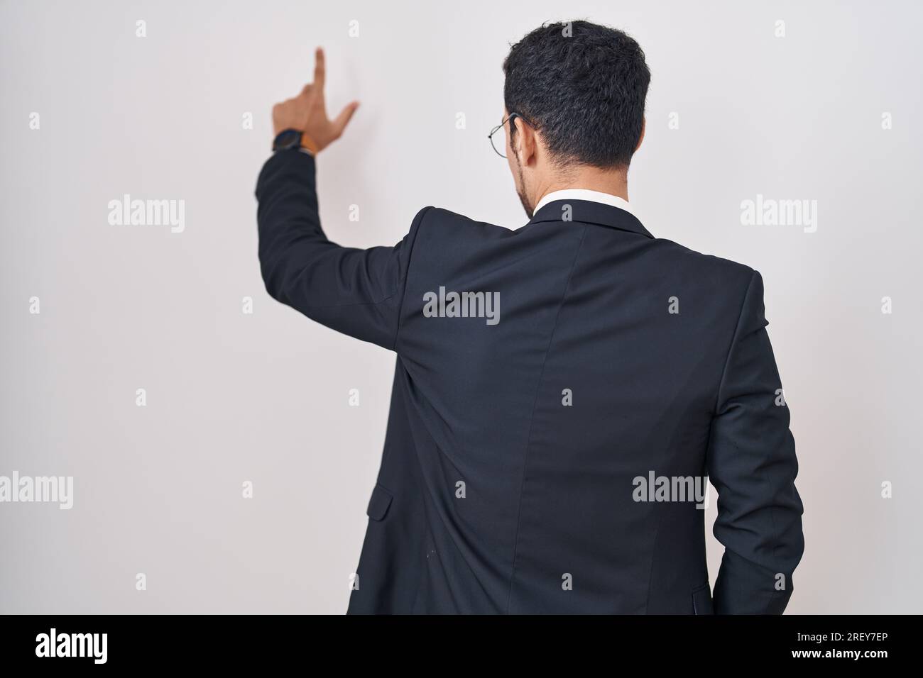 Handsome business hispanic man standing over white background posing ...