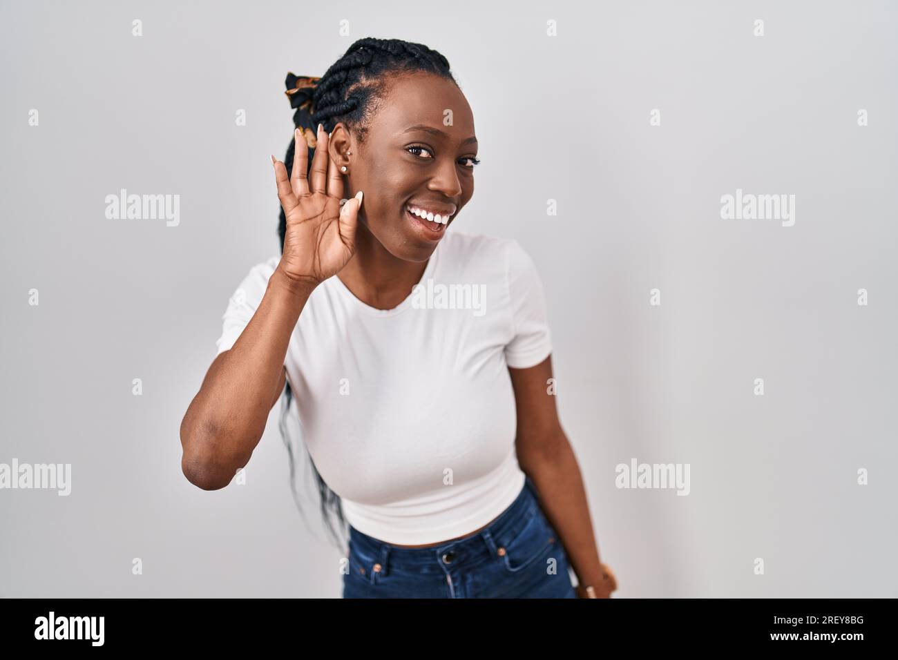 Beautiful black woman standing over isolated background smiling with ...