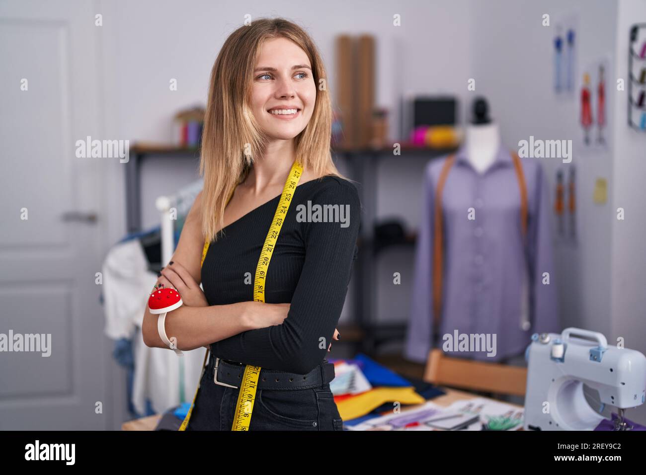Young blonde woman tailor smiling confident standing with arms crossed ...