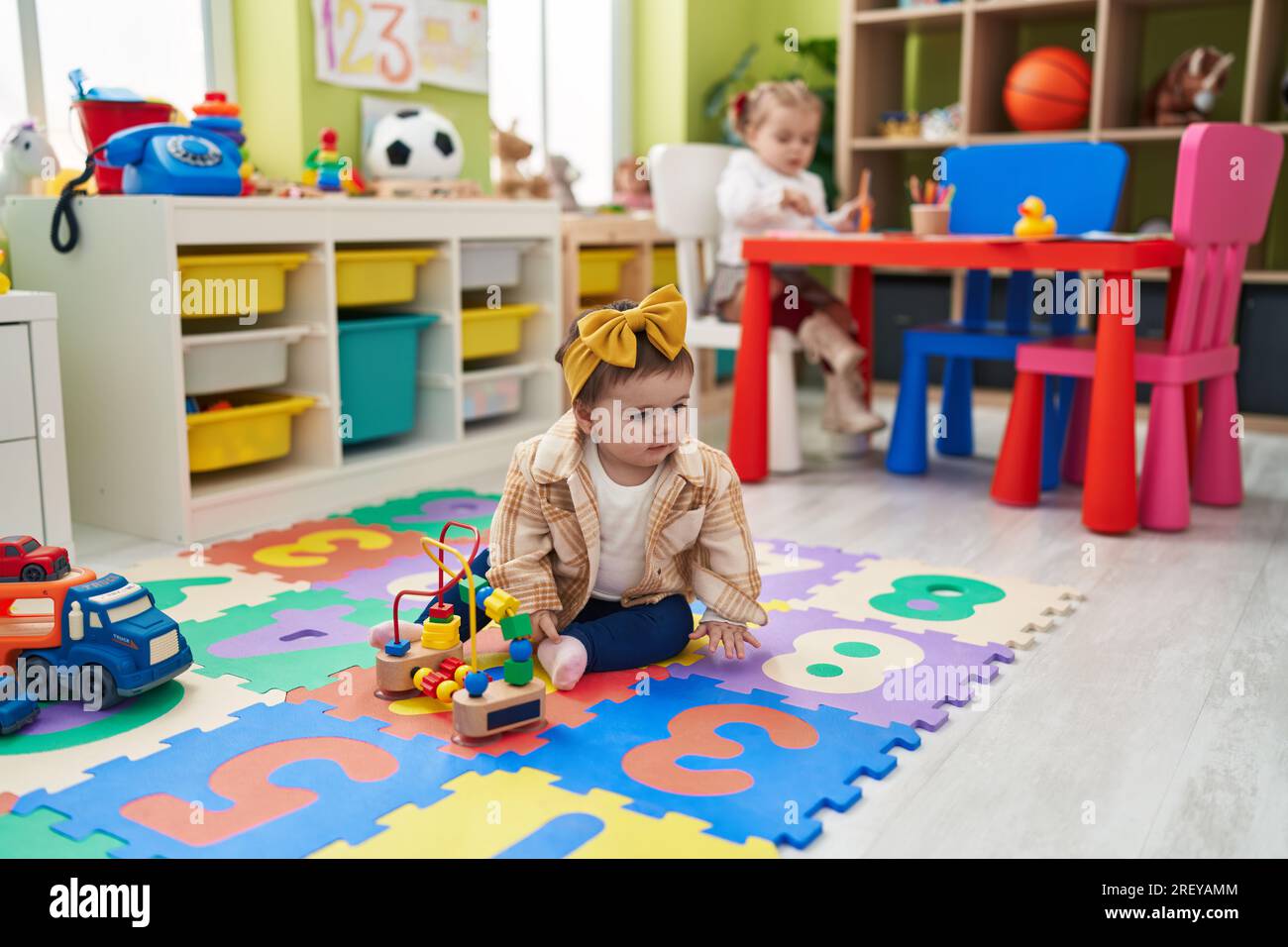 Adorable girls students sitting hi-res stock photography and images - Alamy