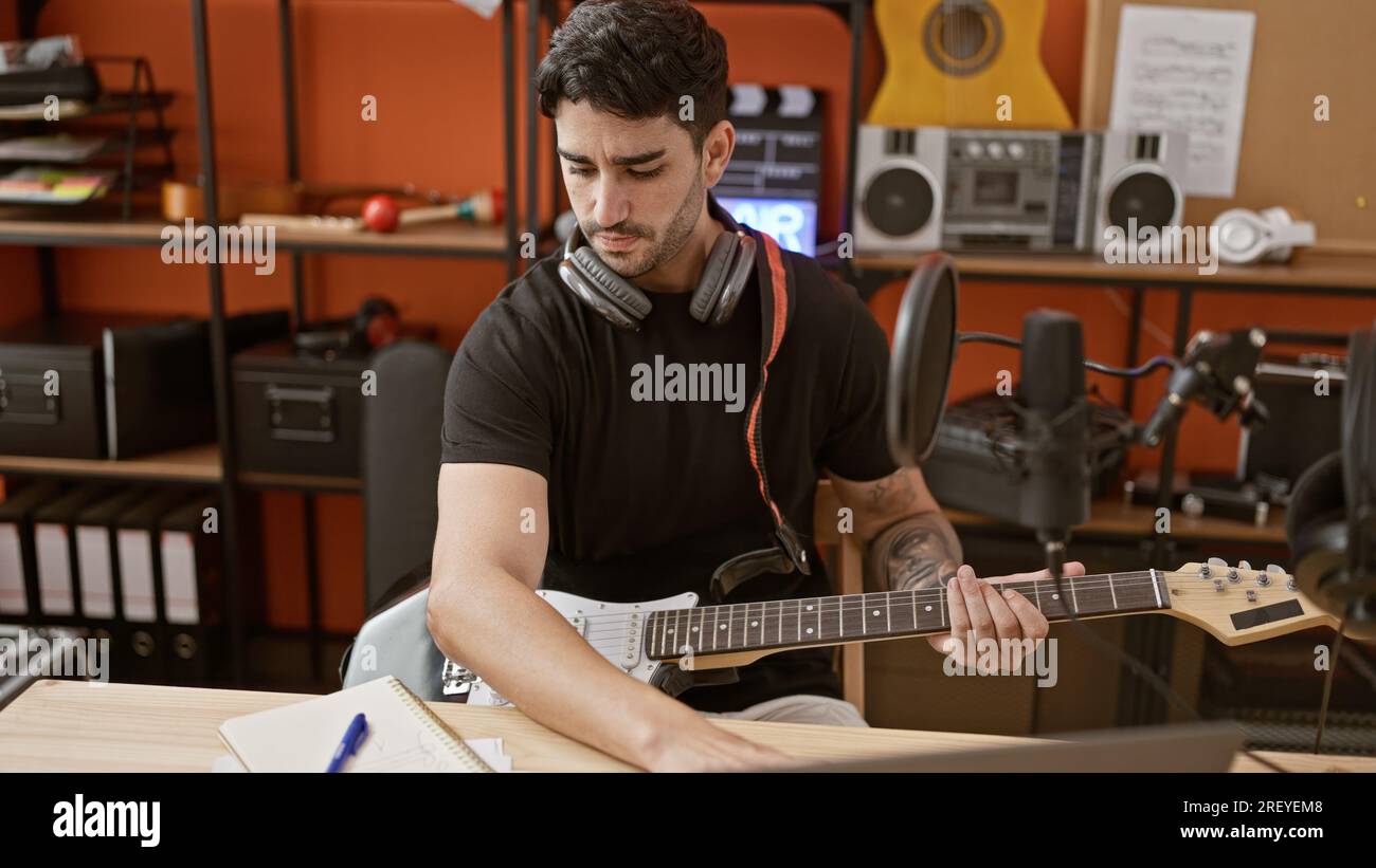 Young musician taking notes composing hi-res stock photography and ...