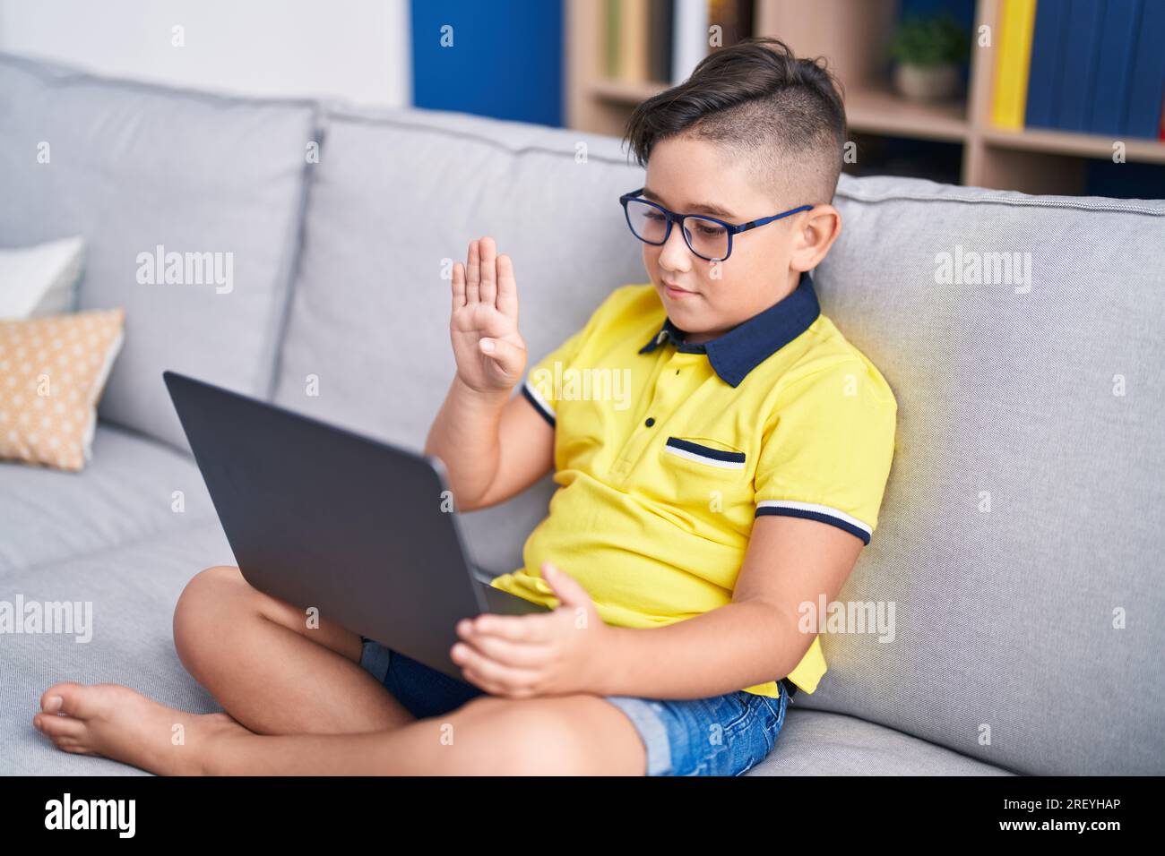 Adorable hispanic boy having video call communicate with sign deaf ...