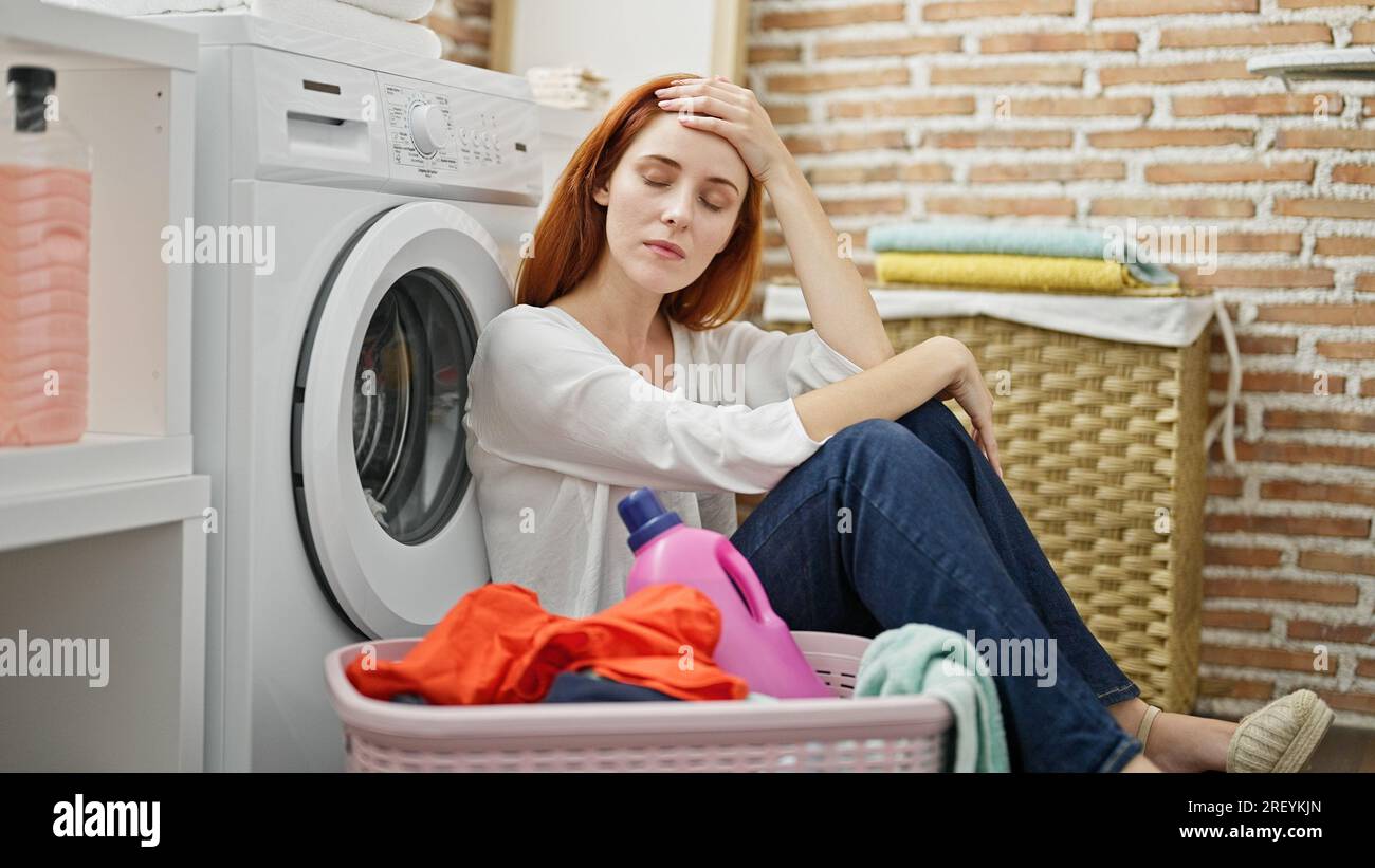 Young redhead woman washing clothes hi-res stock photography and images ...