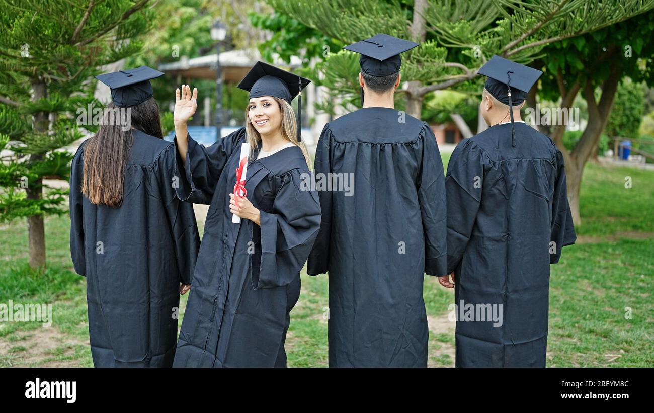 Group of people students graduated holding diploma saying hello with ...