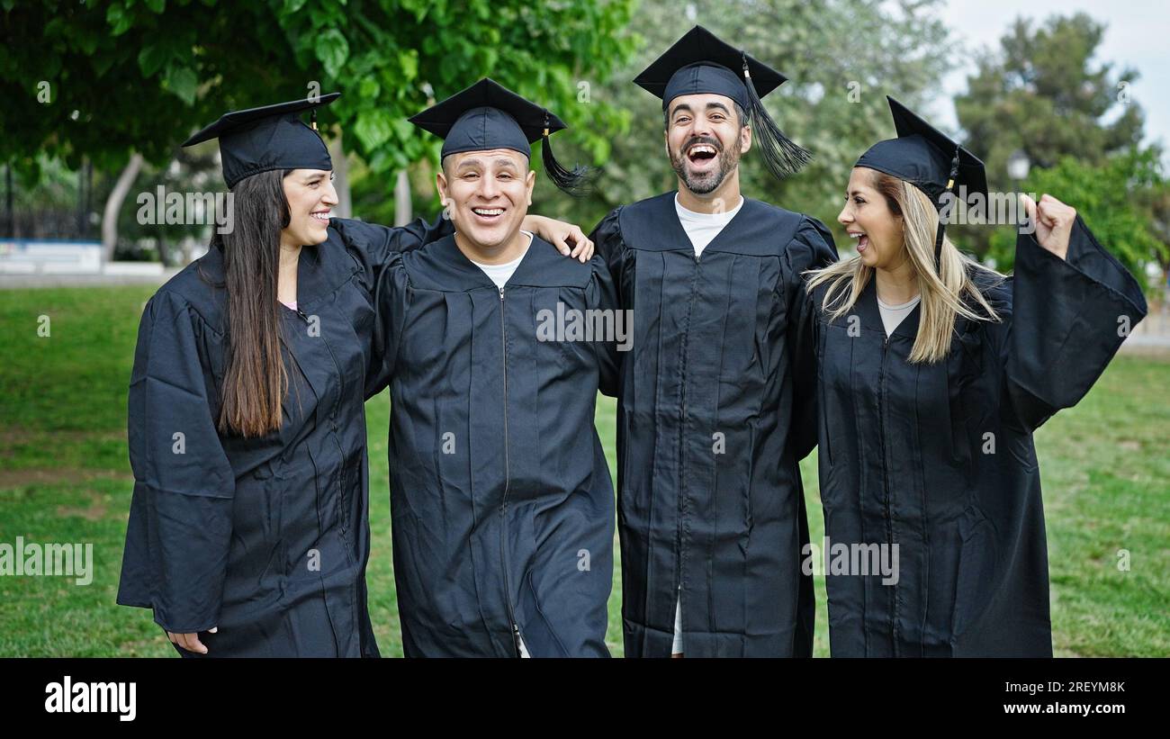 Group of people students graduated smiling confident hugging each other ...