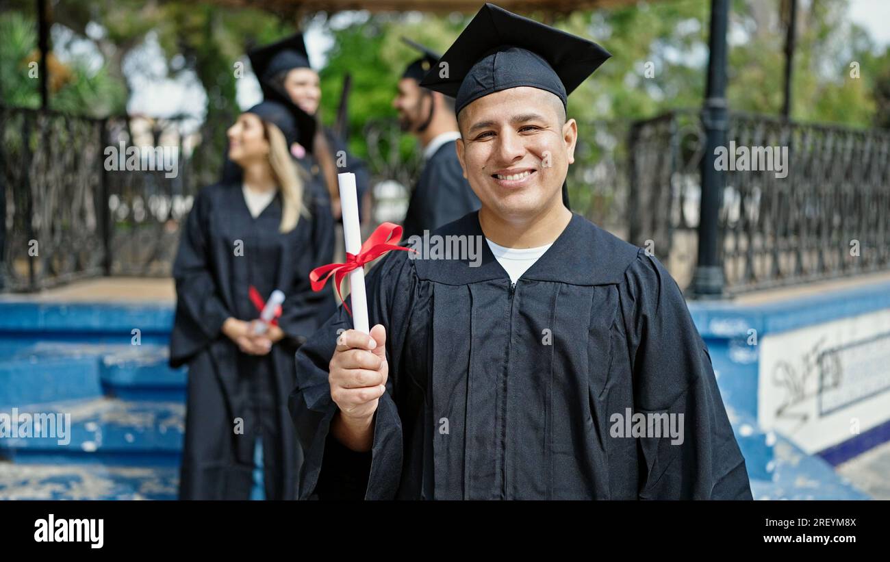 Group of people students graduated holding diploma at university campus ...