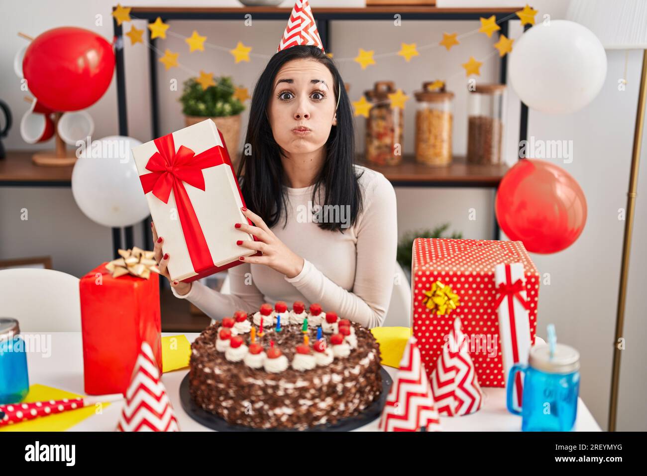 Mouth blowing air into balloons hi-res stock photography and images - Alamy